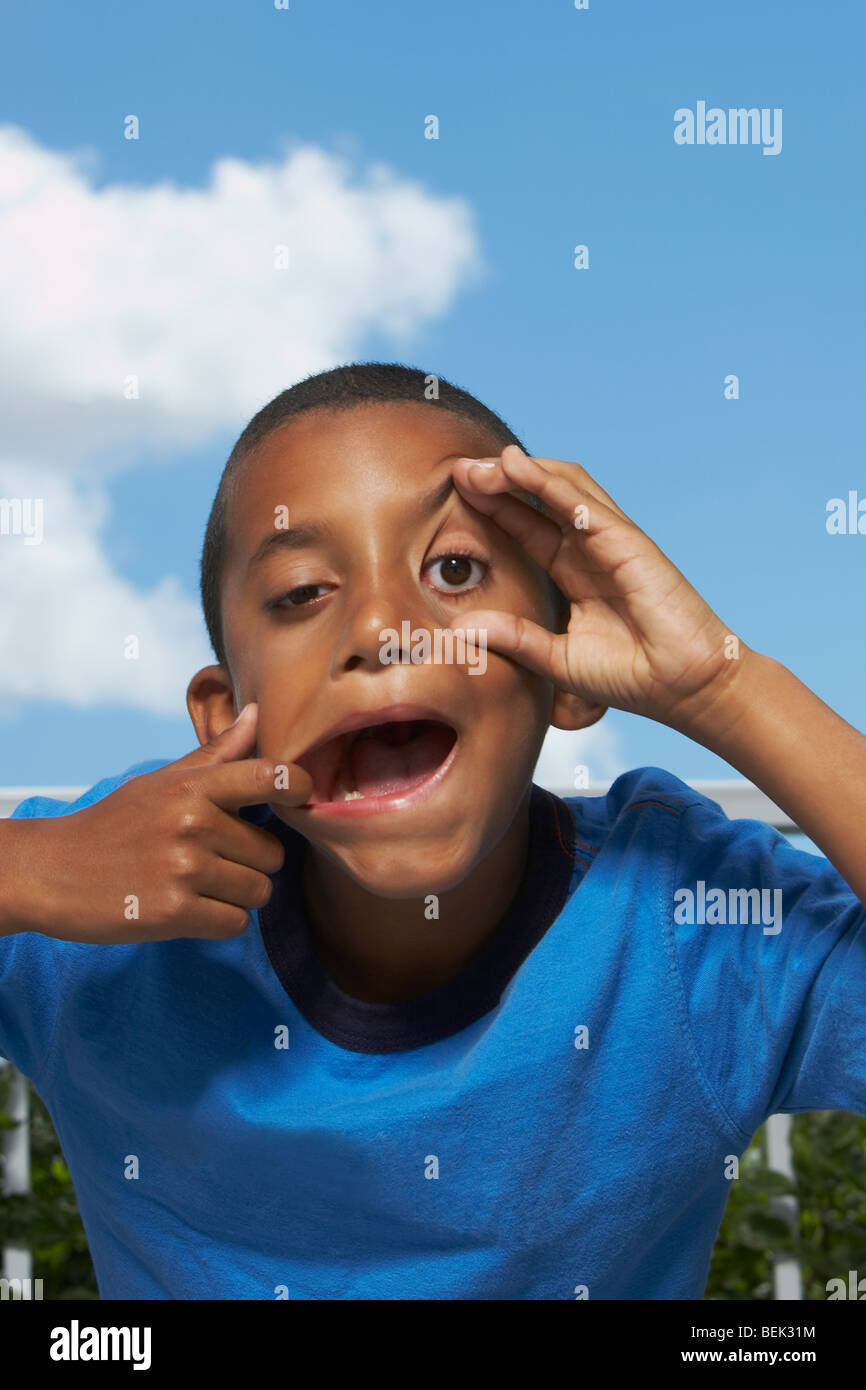 Portrait of a boy making a face Stock Photo - Alamy