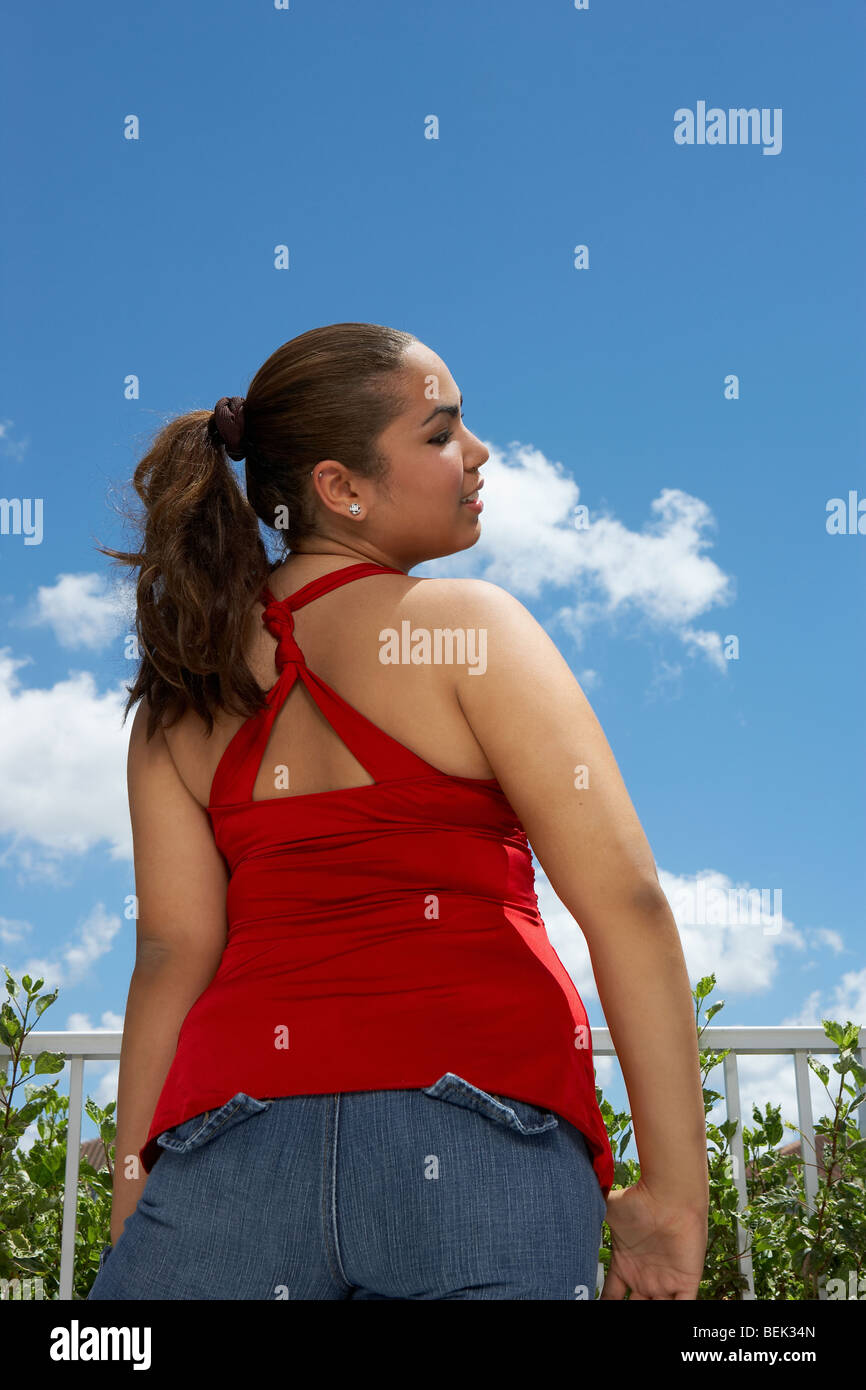 Rear view of a teenage girl standing Stock Photo - Alamy