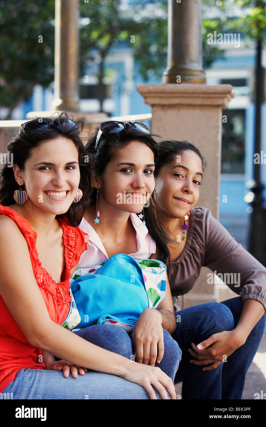 Portrait of three young women sitting and smiling, Old San Juan, San ...