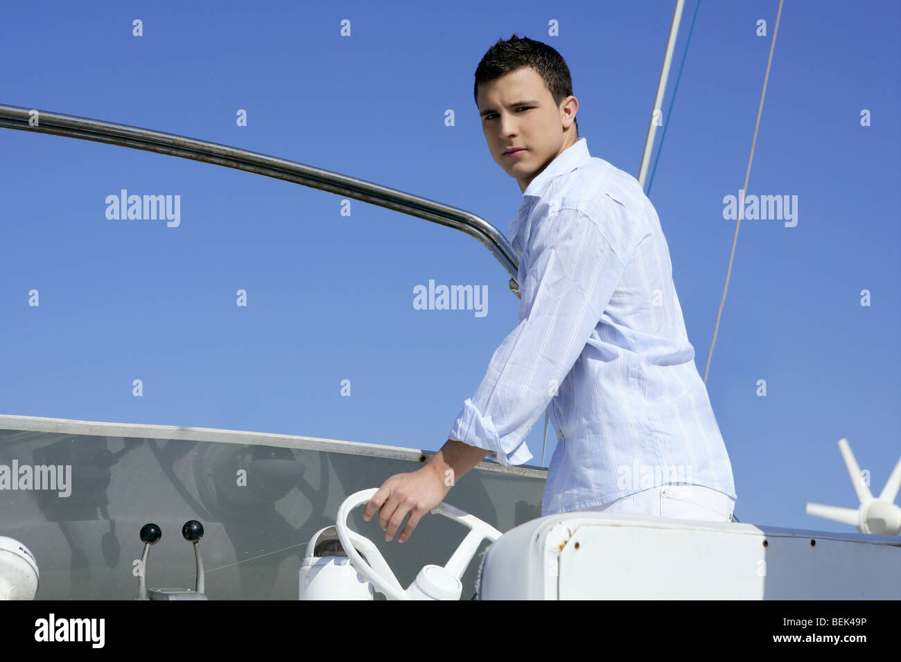 Handsome young man on boat, blue summer vacation outdoor Stock Photo ...