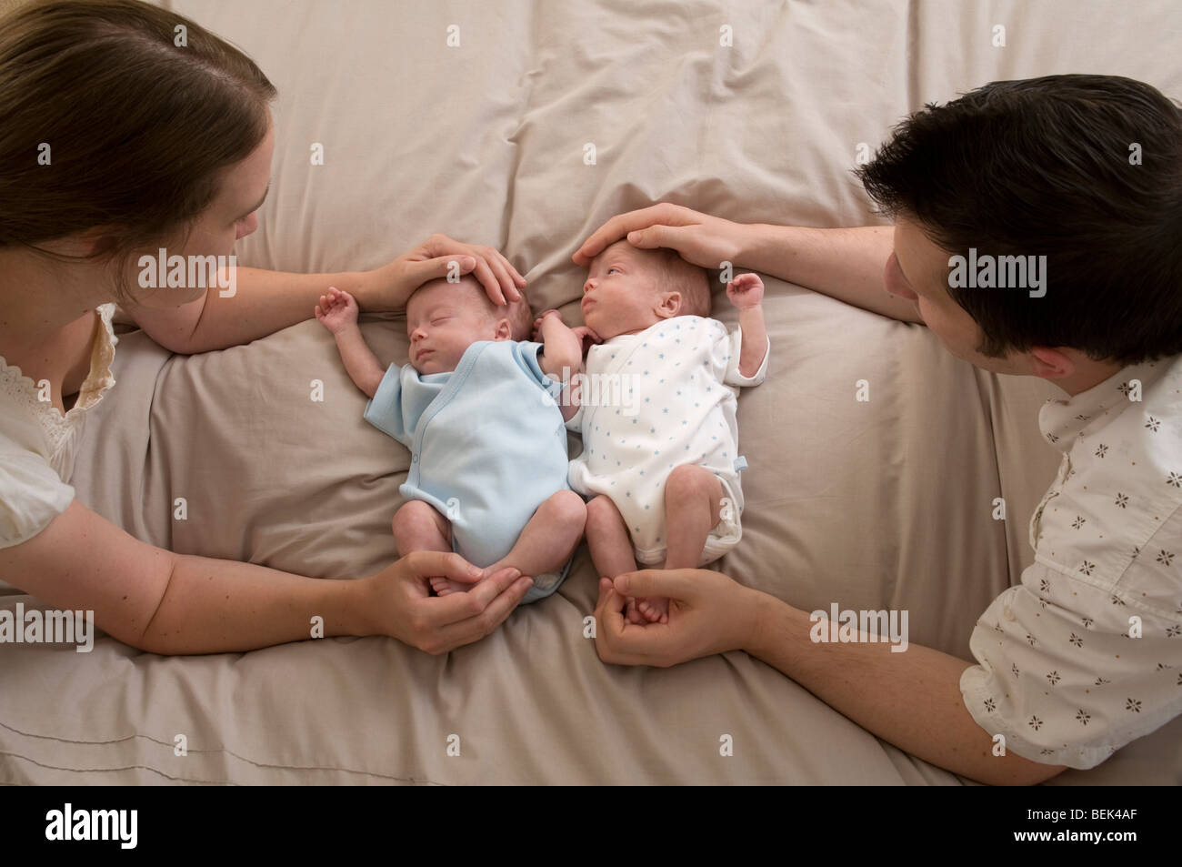 Parents demonstrating containment holding for premature babies Stock ...