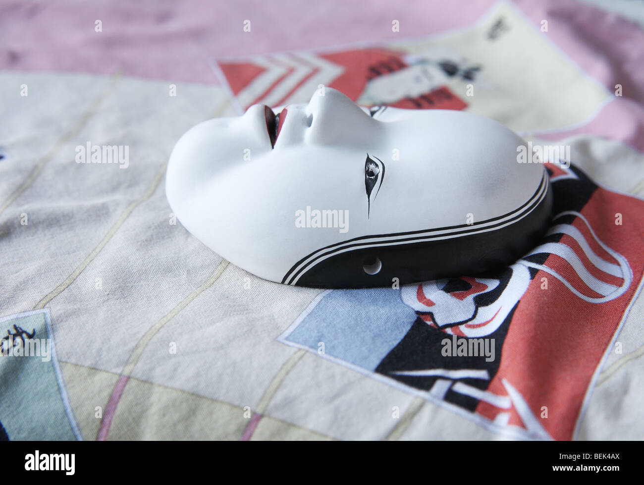 female noh mask on fabric with a Japanese motif Stock Photo - Alamy