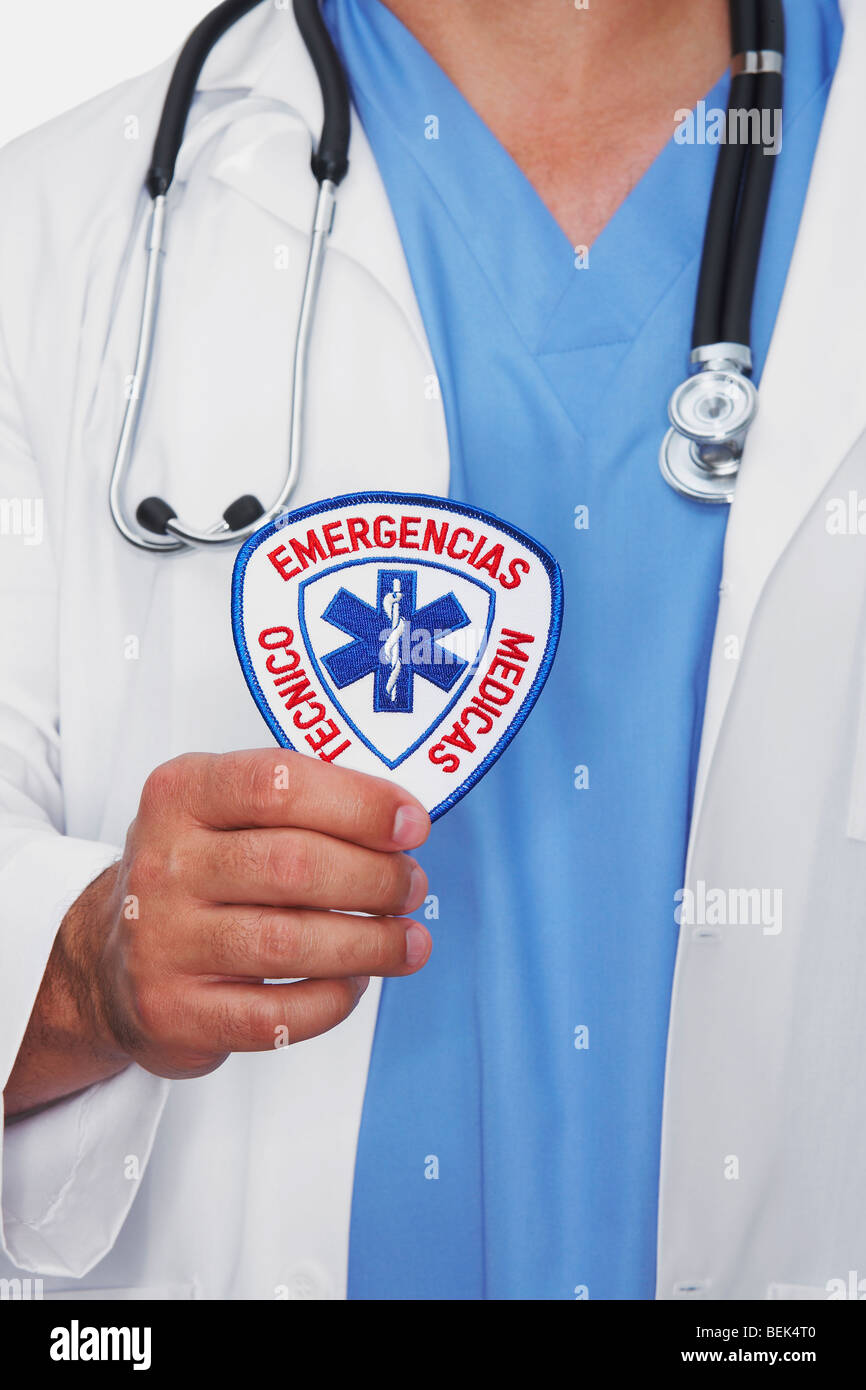 Mid section view of a male doctor holding a badge Stock Photo - Alamy