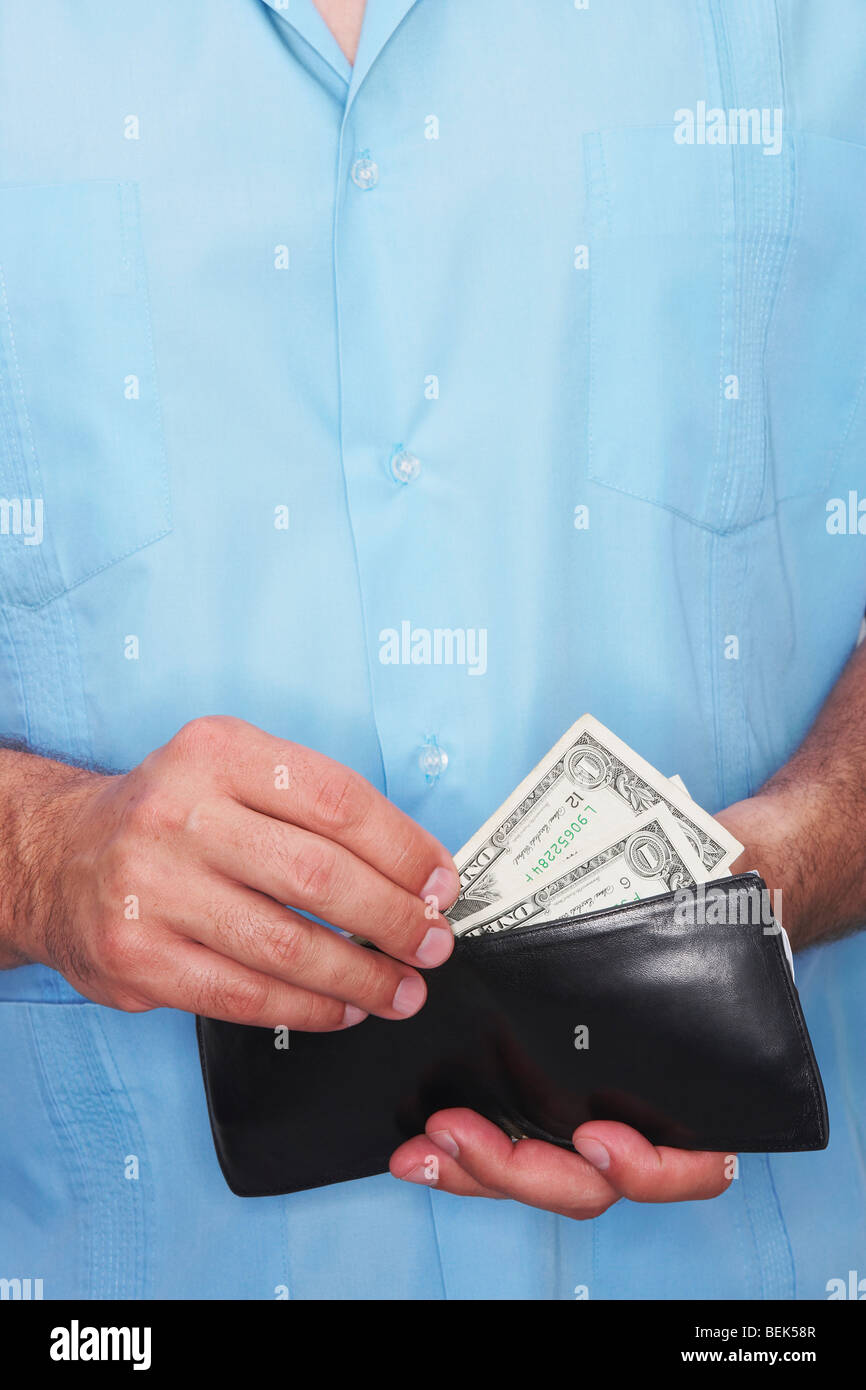 Mid section view of a man taking out money from a wallet Stock Photo ...