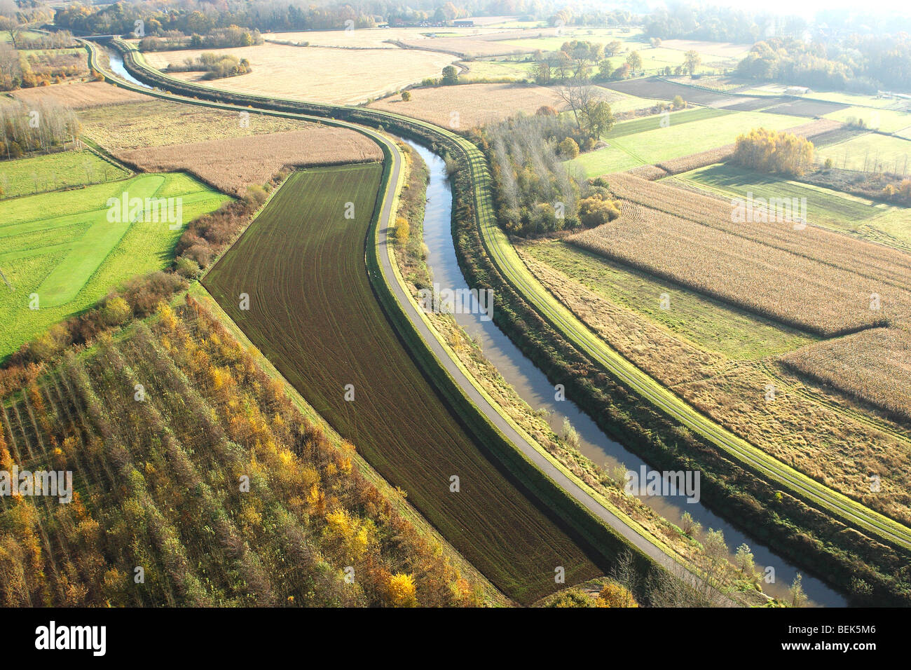 Fields, grasslands and forested area along river Demer from the air in ...