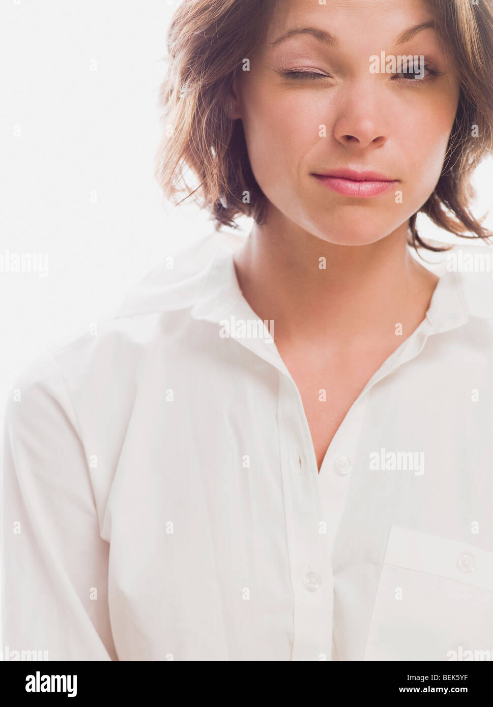 Close-up of a woman winking Stock Photo - Alamy