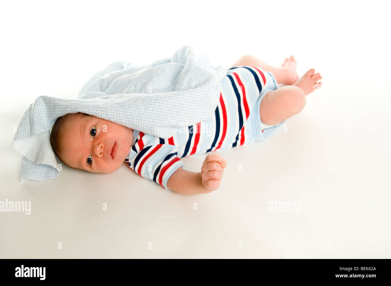 Young baby boy / infant on a white background Stock Photo - Alamy