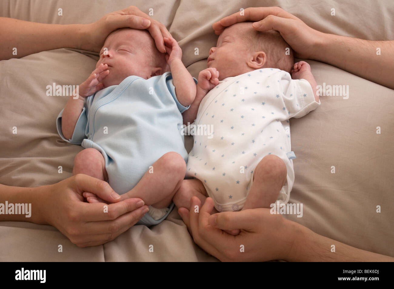 Parents demonstrating containment holding for premature babies Stock ...