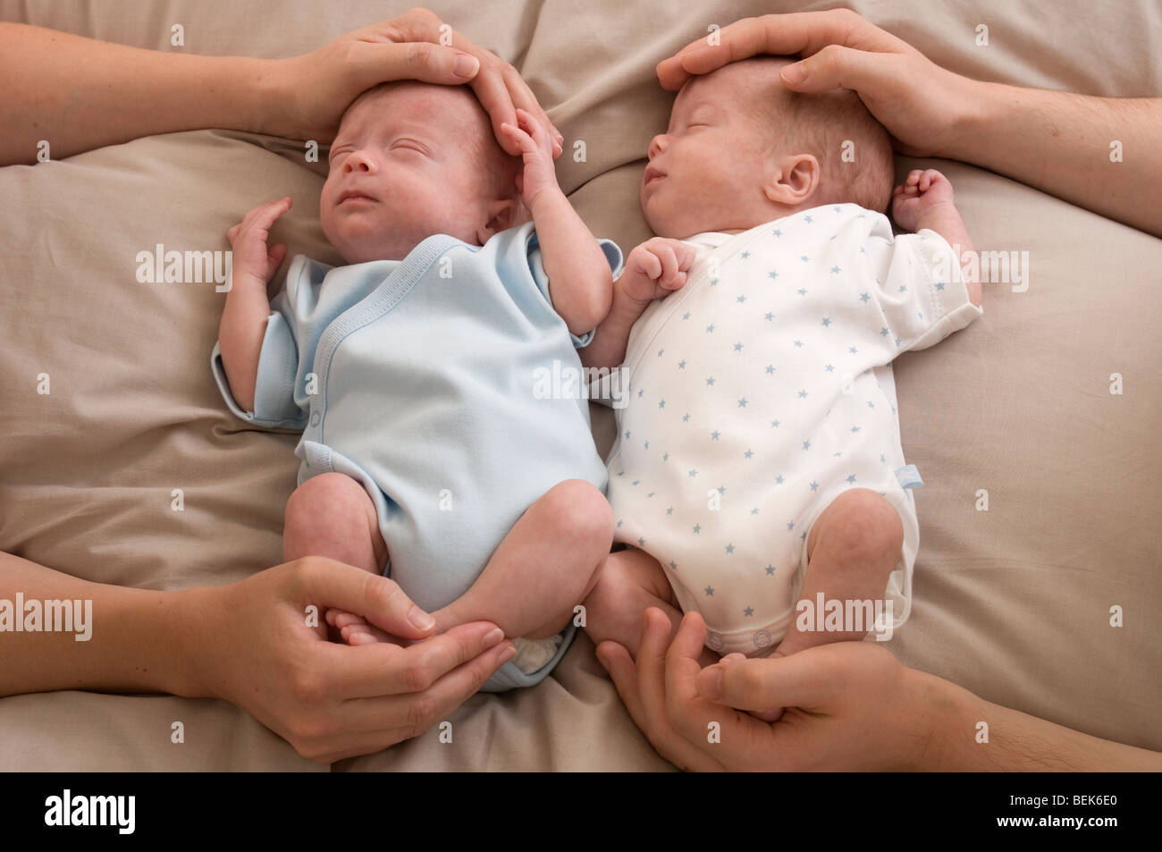 Parents demonstrating containment holding for premature babies Stock ...