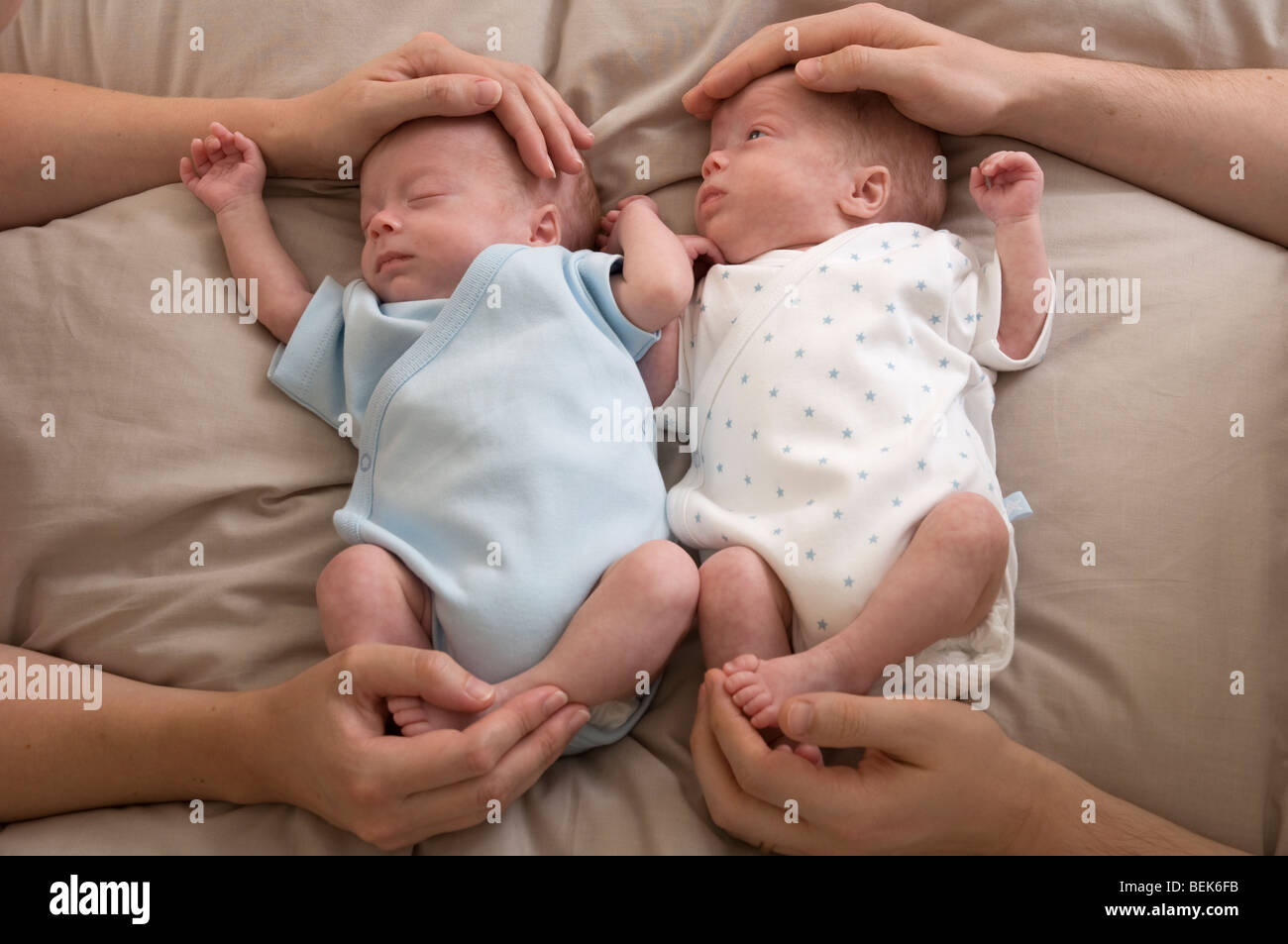 Parents demonstrating containment holding for premature babies Stock ...