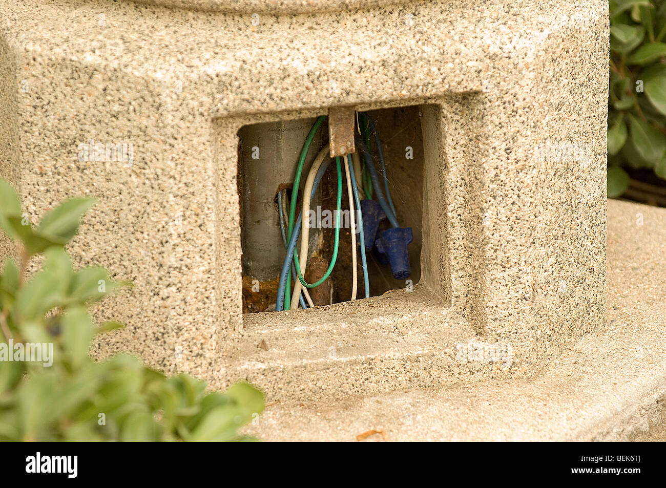 Exposed electrical wiring in the base of a public light fixture Stock ...