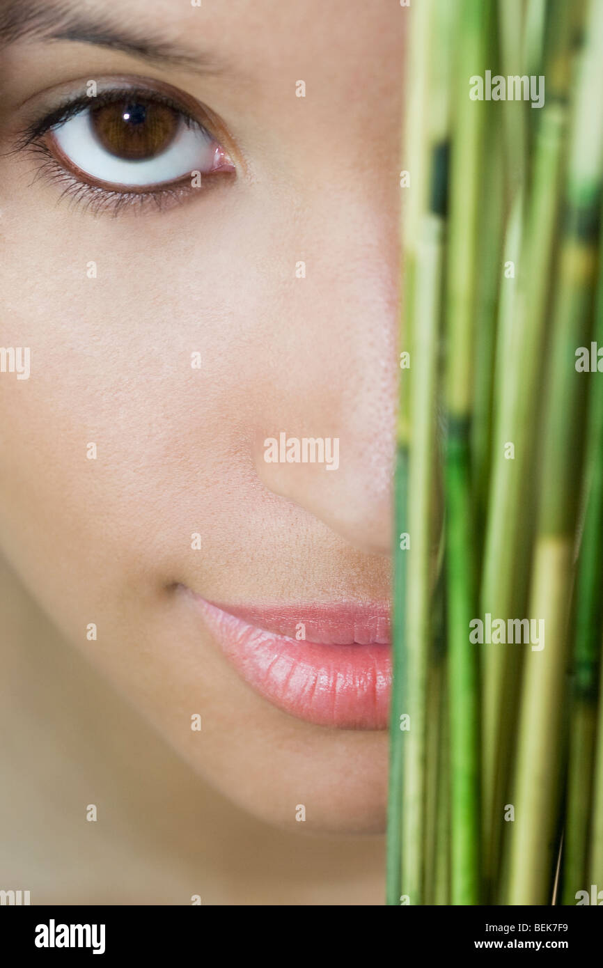 Close-up of a woman's face with plants Stock Photo - Alamy