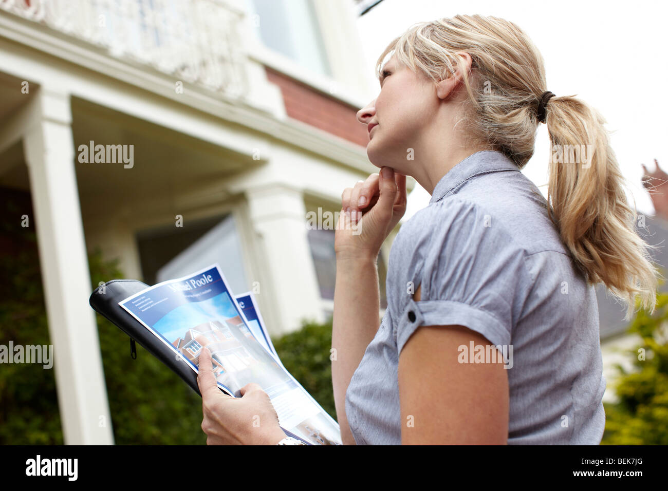 Woman viewing property Stock Photo - Alamy