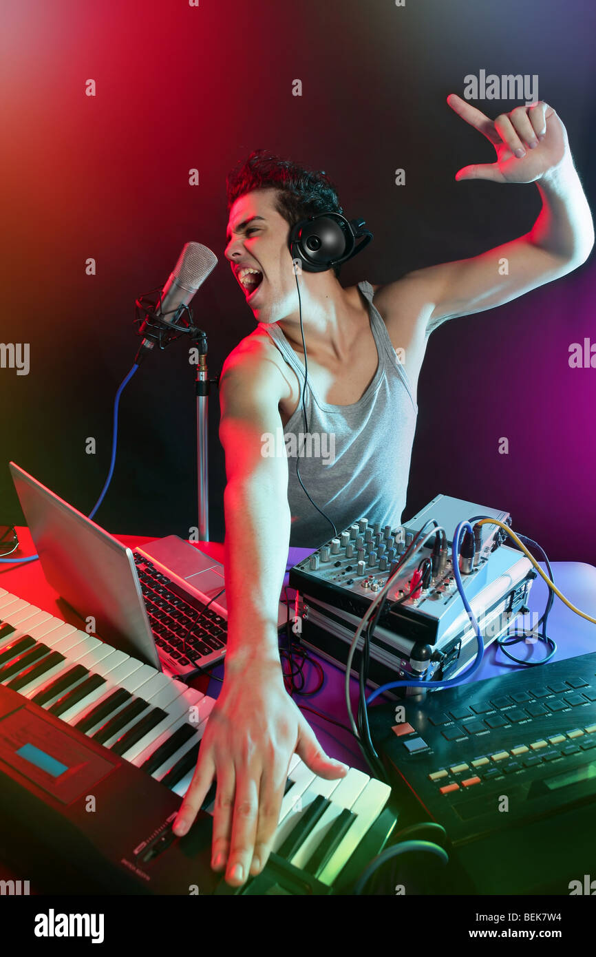Dj with colorful light and music mixing digital equipment Stock Photo ...