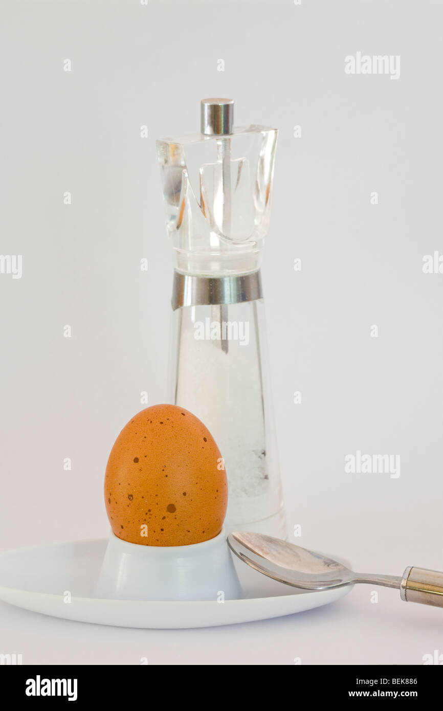 Boiled egg, egg cup and salt cellar Stock Photo - Alamy