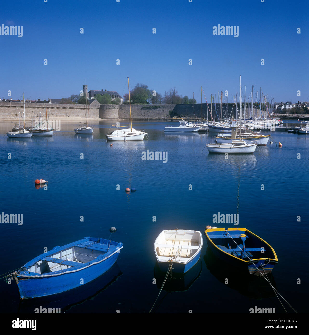 Finistere. Harbour. Old wall. Ramparts and tower. Boats moored ...