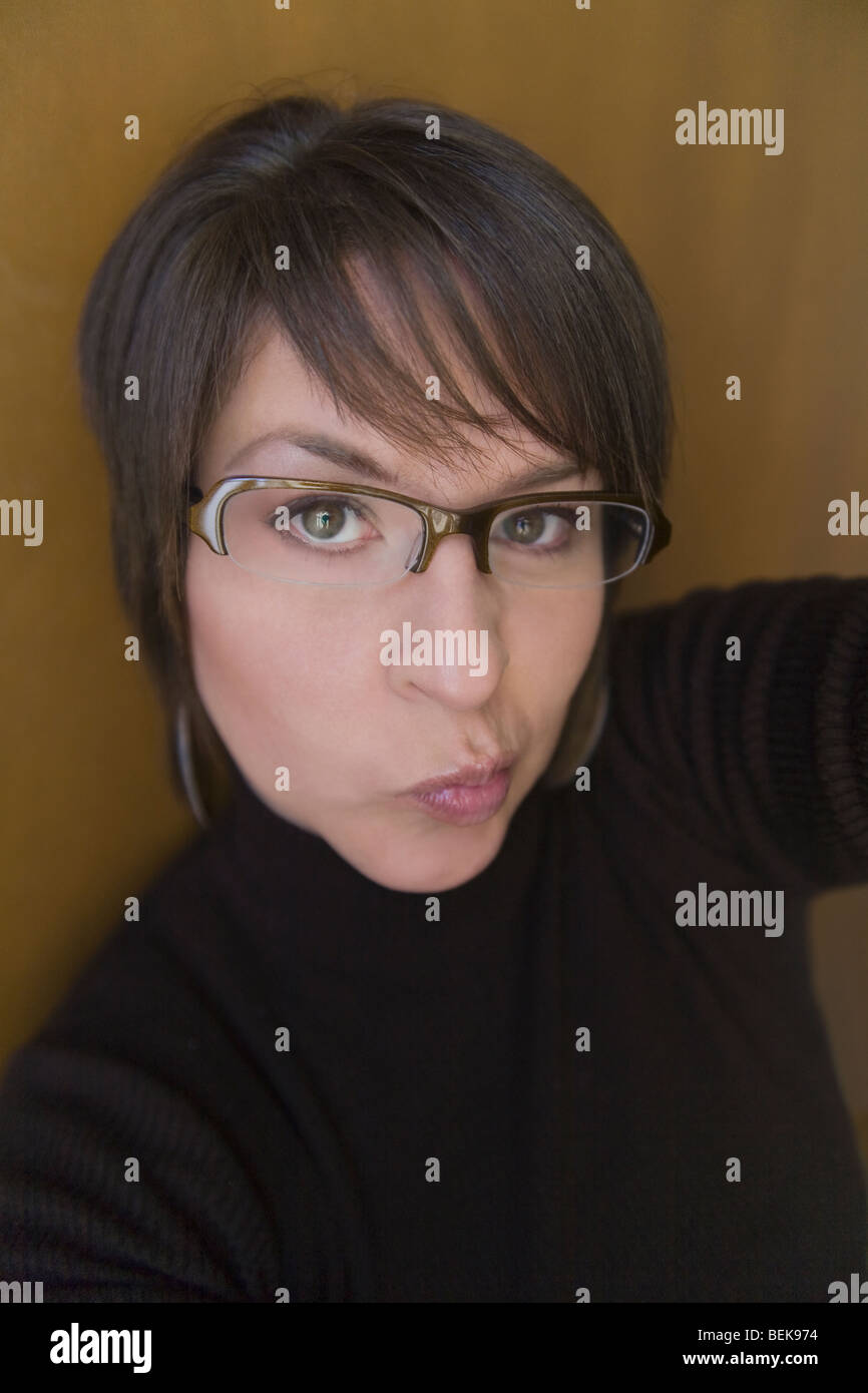Portrait of a woman making a face Stock Photo - Alamy