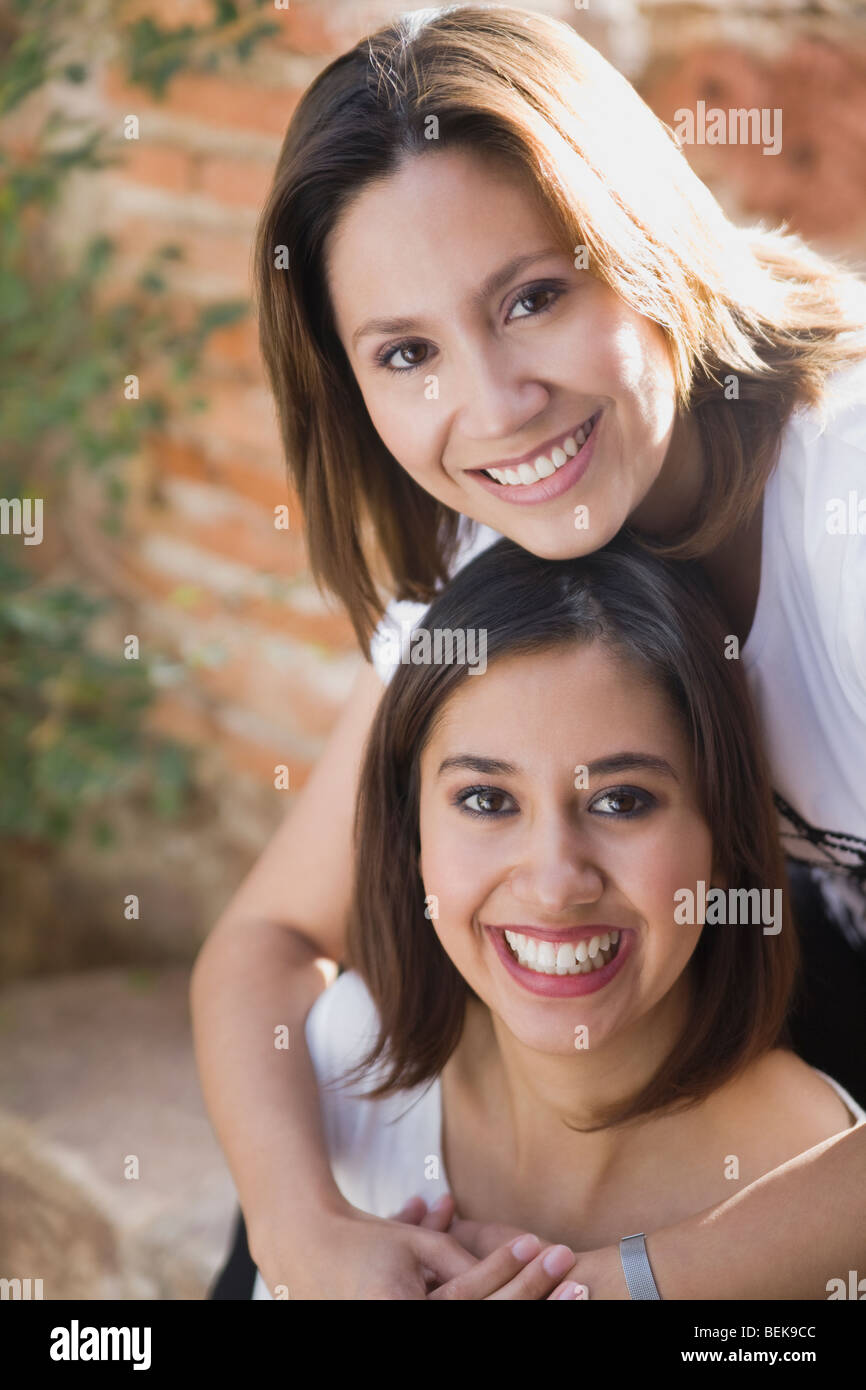 Portrait of two women smiling Stock Photo - Alamy