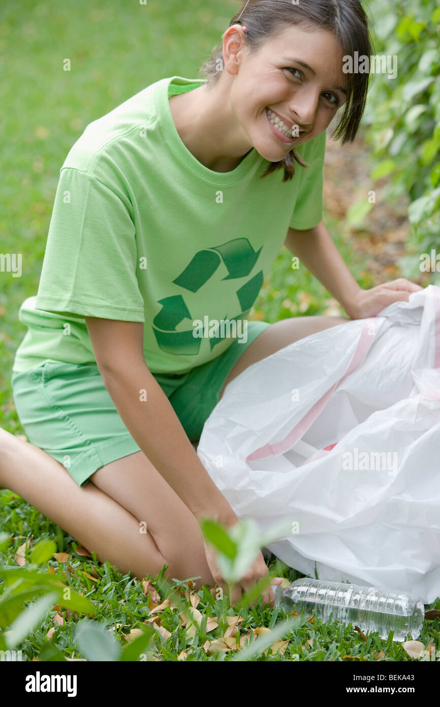 Teenage girl collecting garbage in a park Stock Photo - Alamy