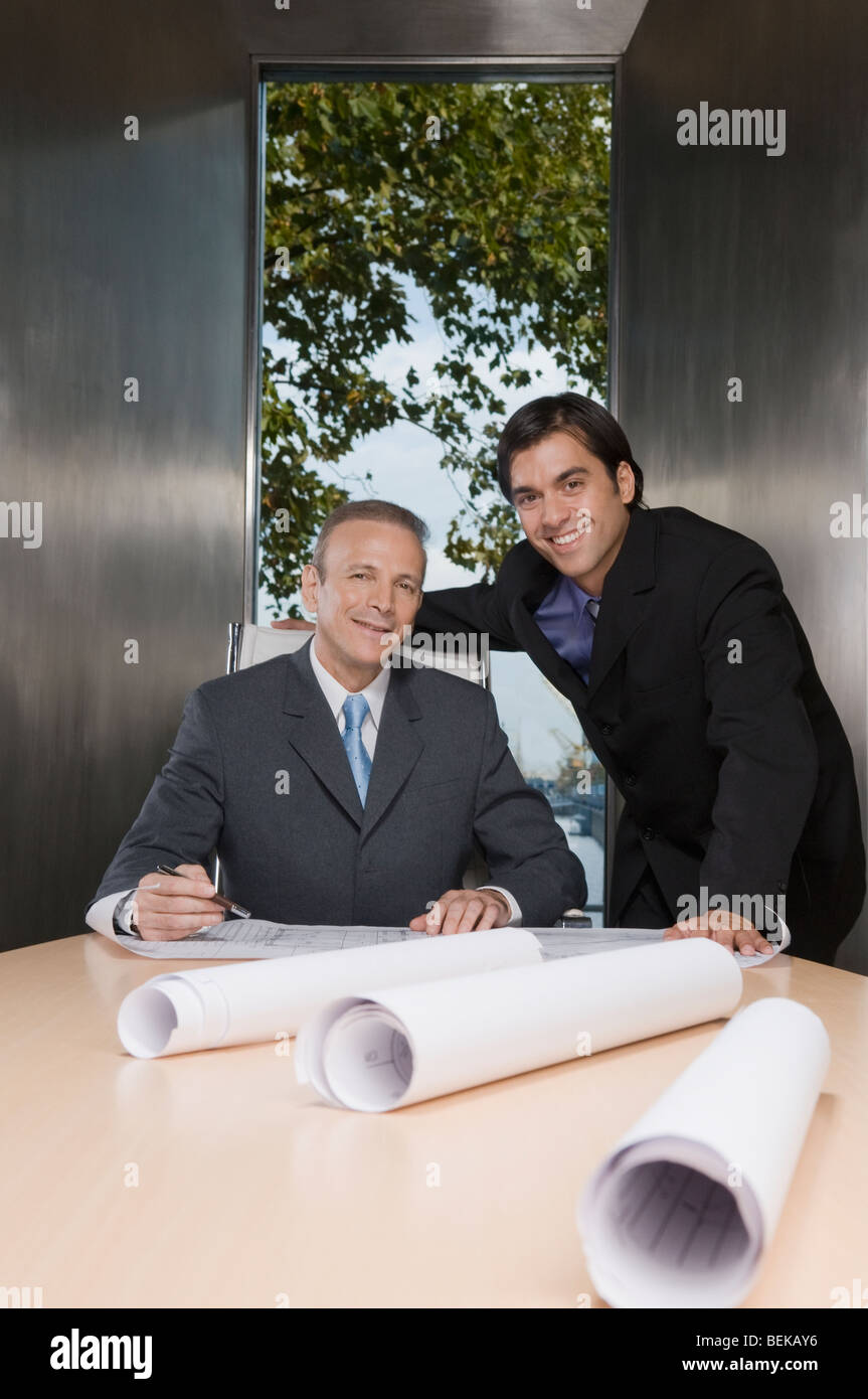 Two businessmen smiling in a conference room Stock Photo - Alamy