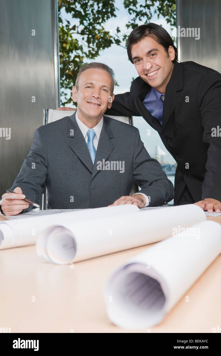 Two businessmen smiling in a conference room Stock Photo - Alamy