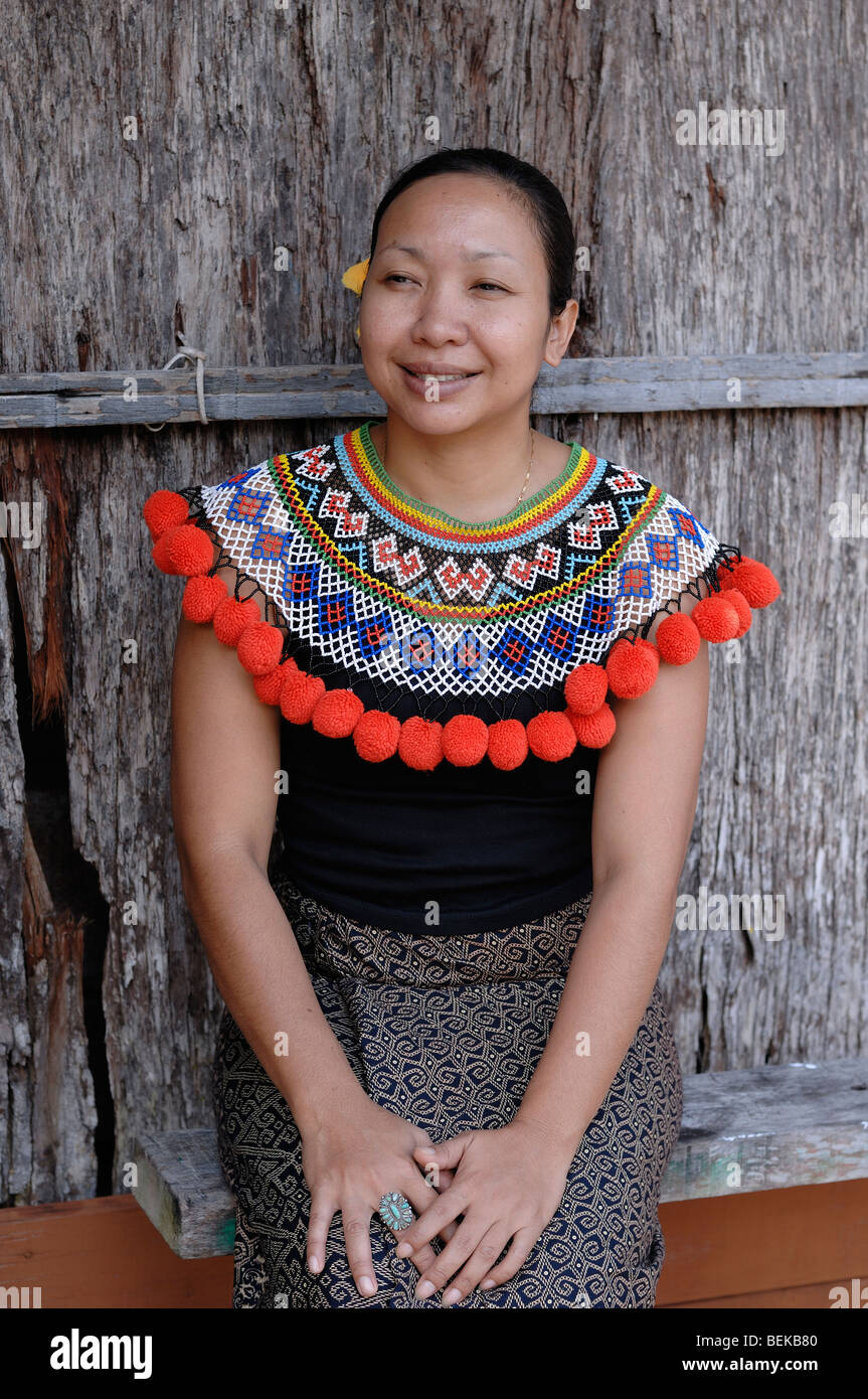 Portrait of a Smiling Woman of the Iban Tribe Wearing Traditional ...