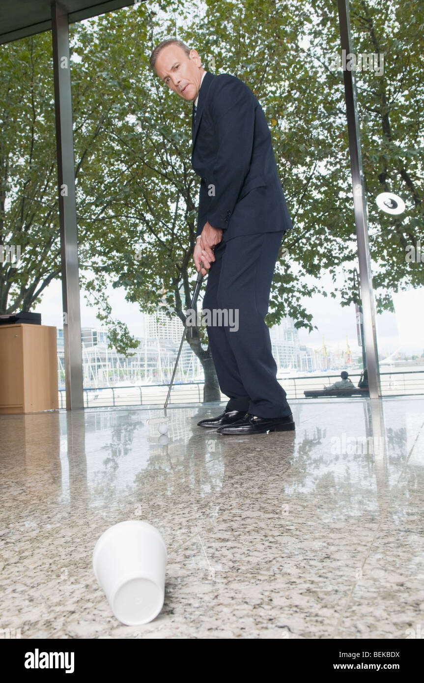 Business executive playing golf hi-res stock photography and images - Alamy