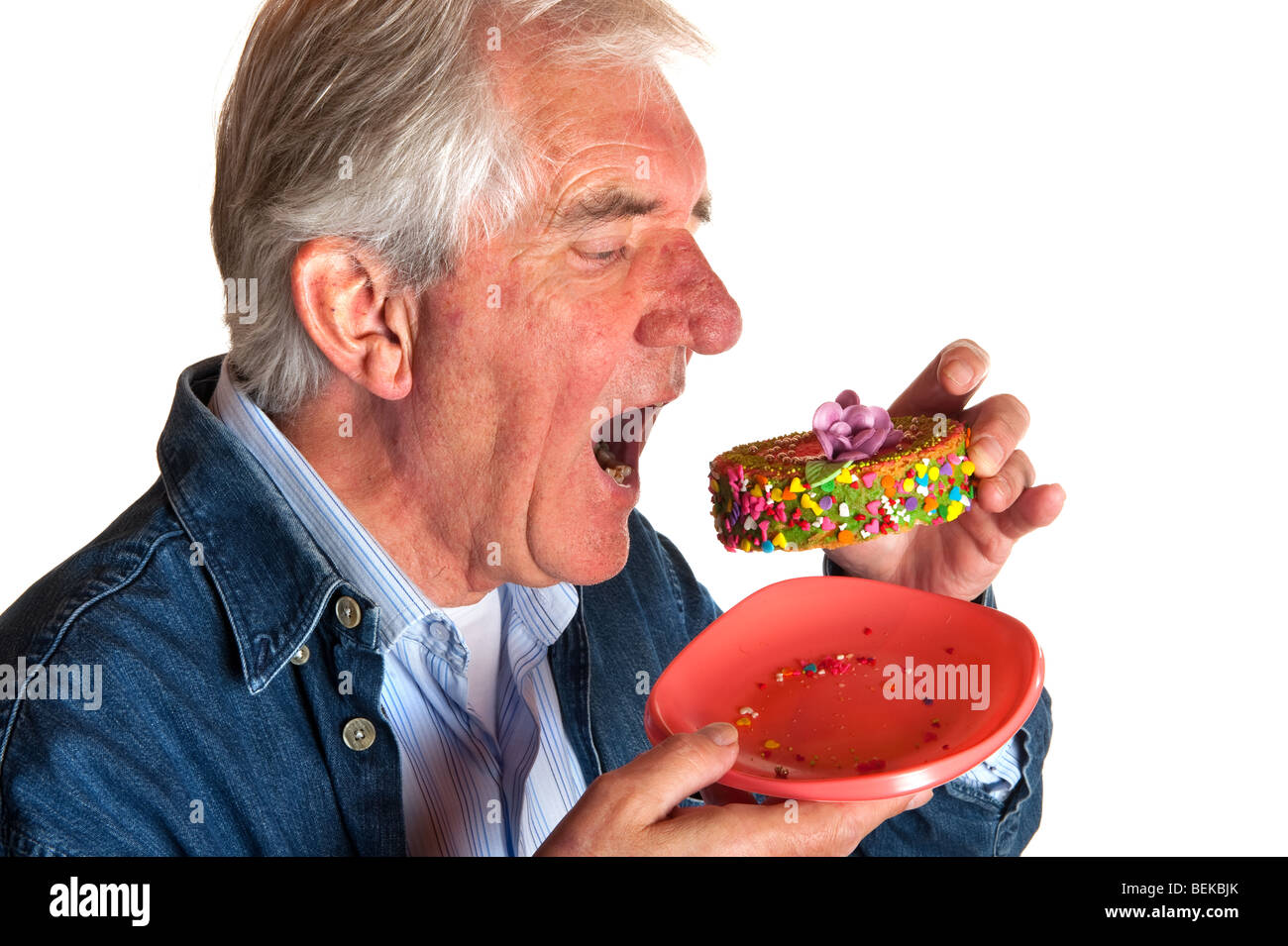 Old man eating birthday cake hi-res stock photography and images - Alamy