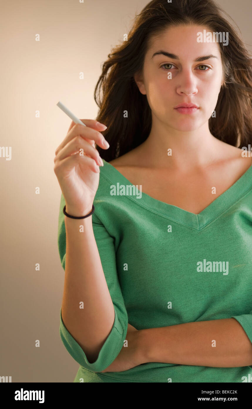 Portrait of a woman smoking a cigarette Stock Photo - Alamy