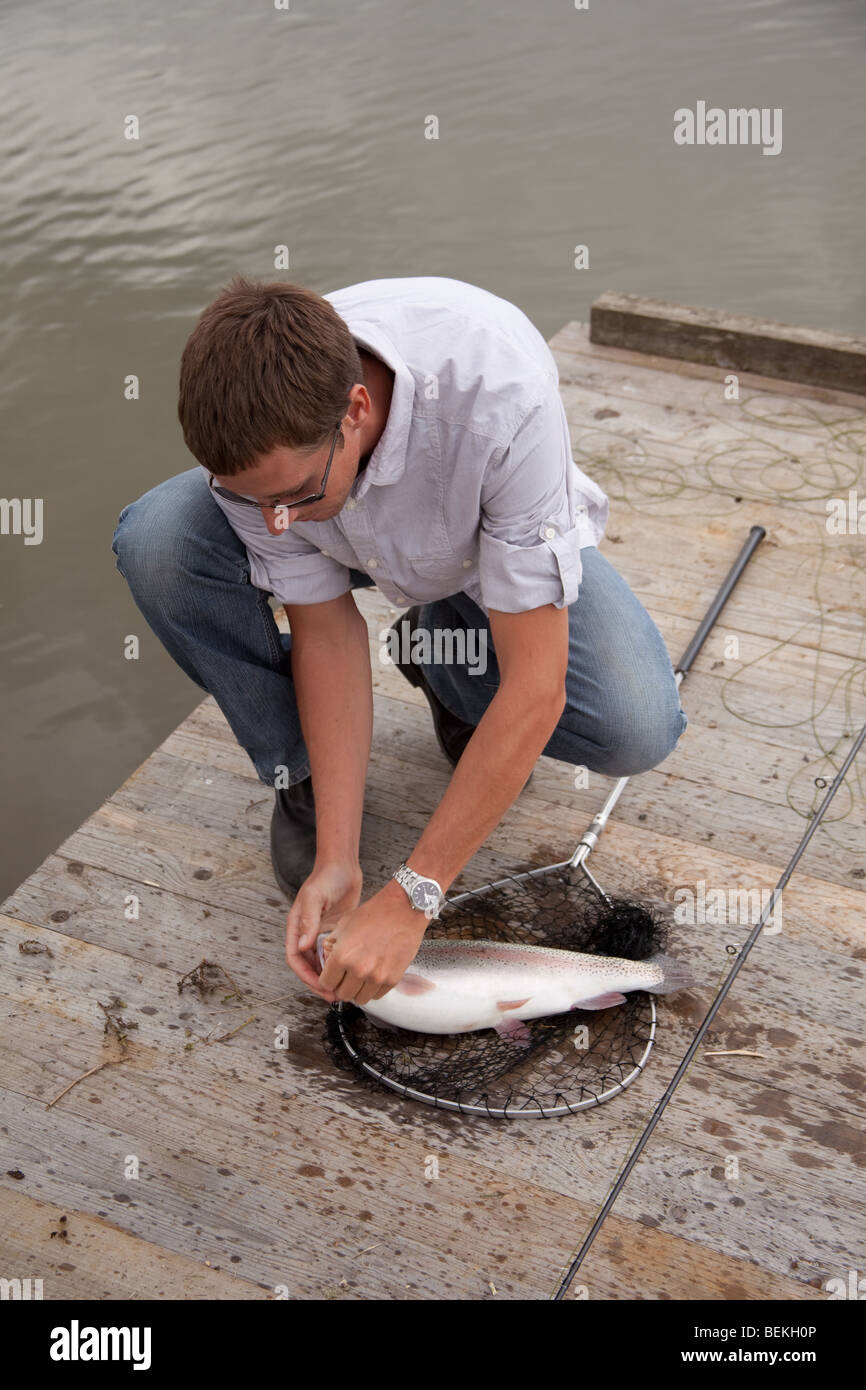 A happy trout fisherman with a 4lb 5oz rainbow trout at Norton Trout ...
