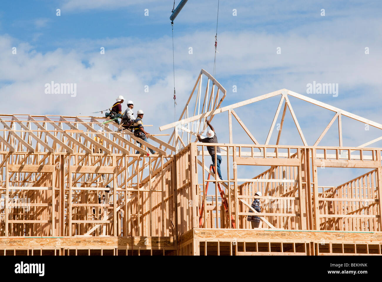 Crane lifting wood truss roof hi-res stock photography and images - Alamy