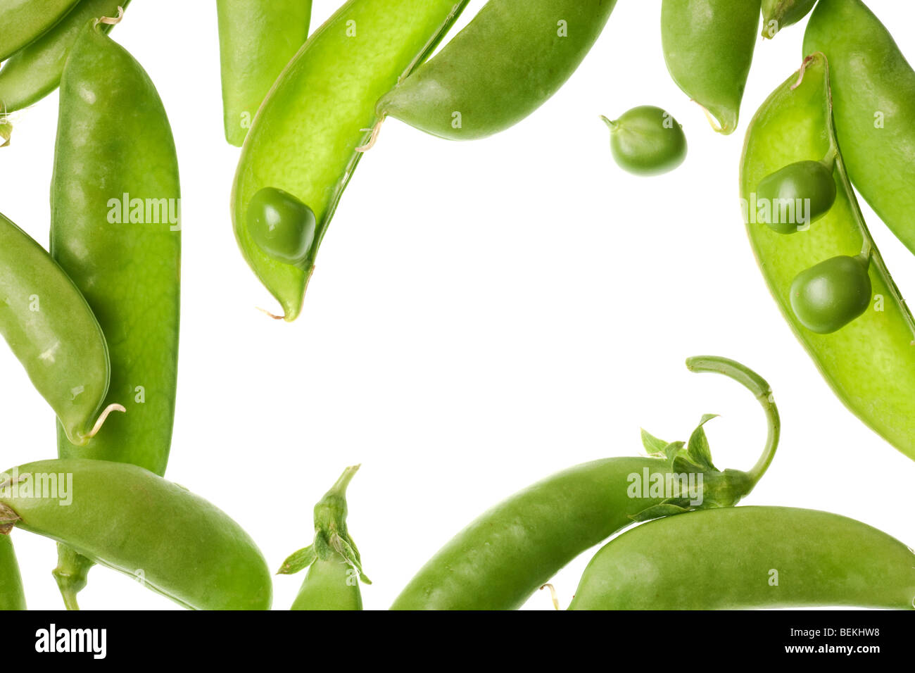 green pea pods isolated on white background Stock Photo - Alamy