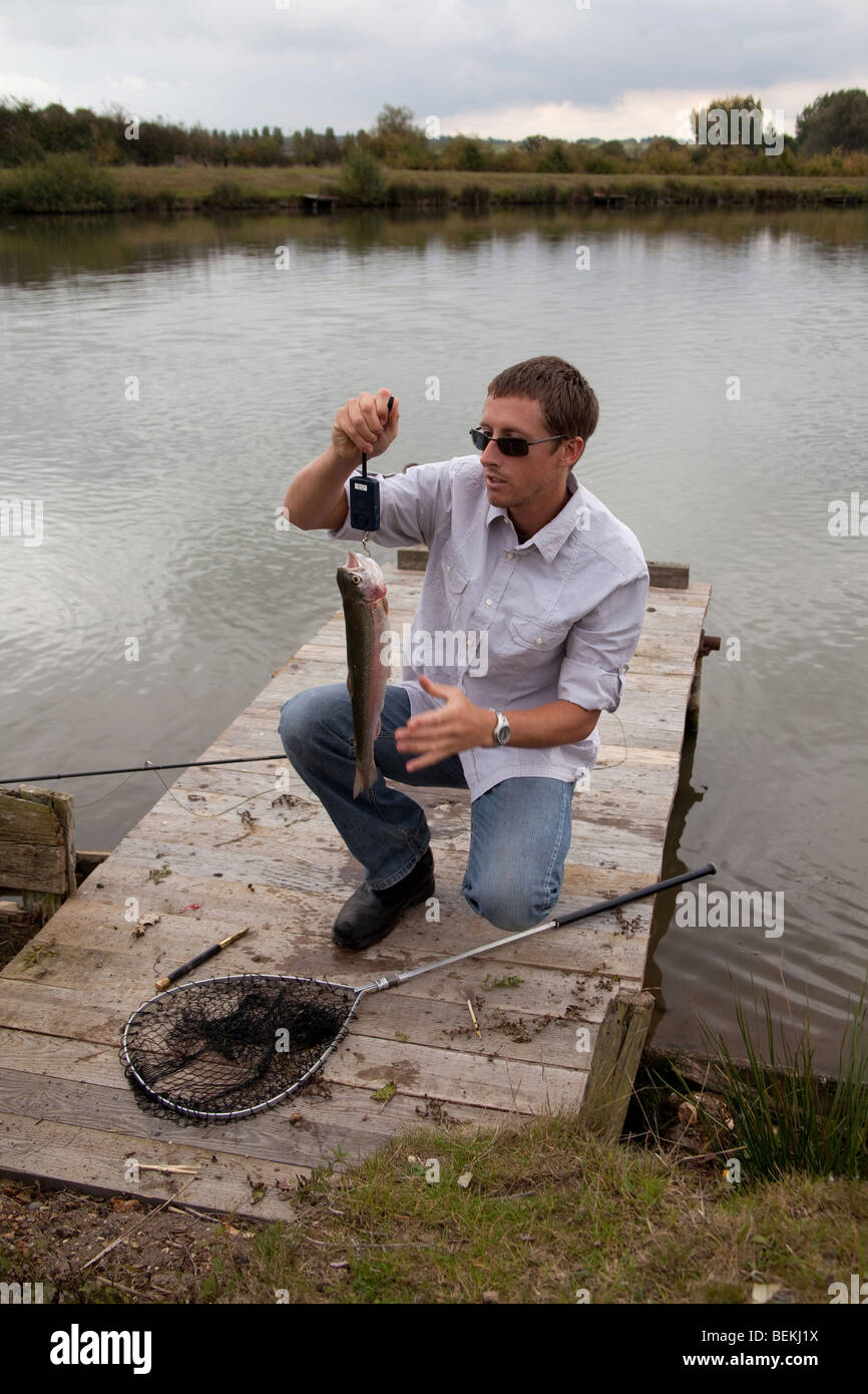 A happy trout fisherman with a 3lb rainbow trout at Norton Trout ...