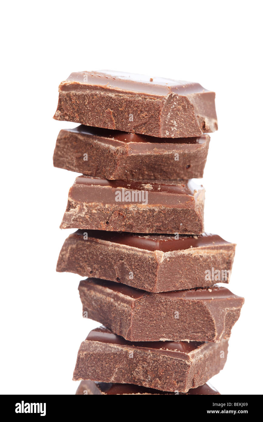 Blocks of chocolate isolated on white background. Shallow depth of ...