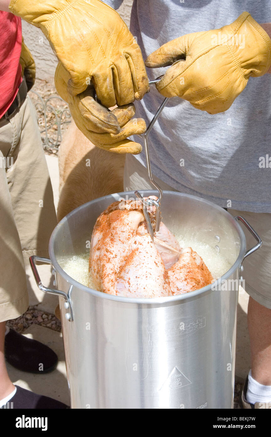 a turkey is deep fried for a holiday meal Stock Photo - Alamy