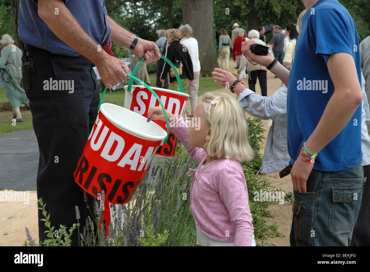 Young child donating money for Charity Stock Photo - Alamy
