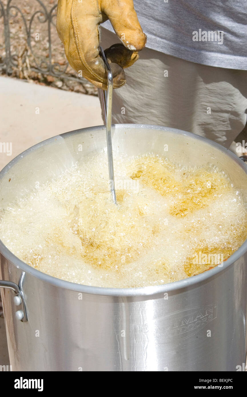 a turkey is deep fried for a holiday meal Stock Photo - Alamy