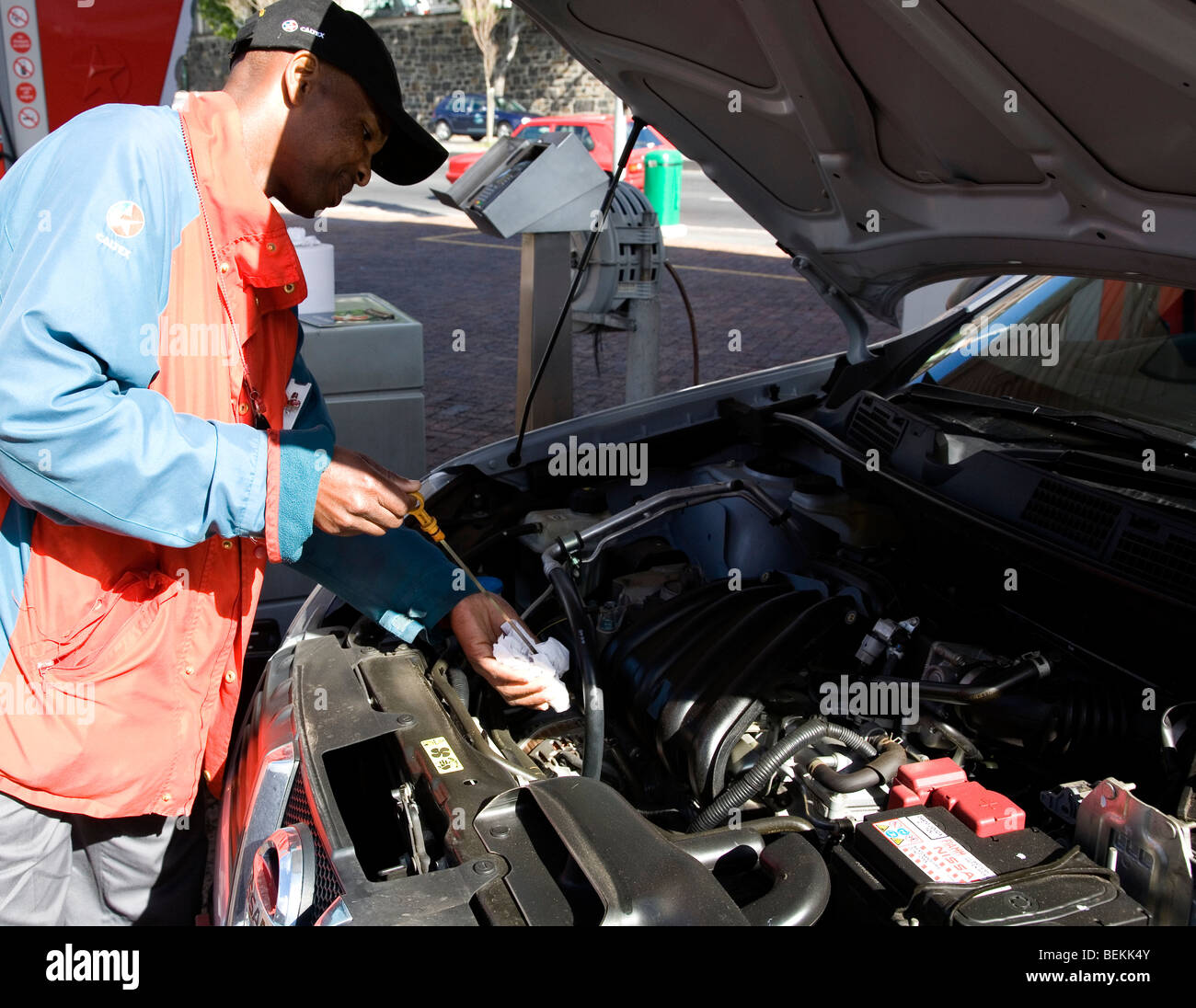 Mechanic checks oil Stock Photo - Alamy