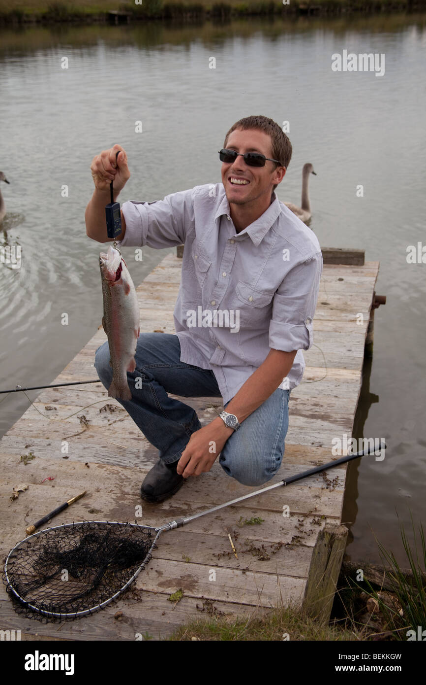 A happy trout fisherman with a 3lb rainbow trout at Norton Trout ...