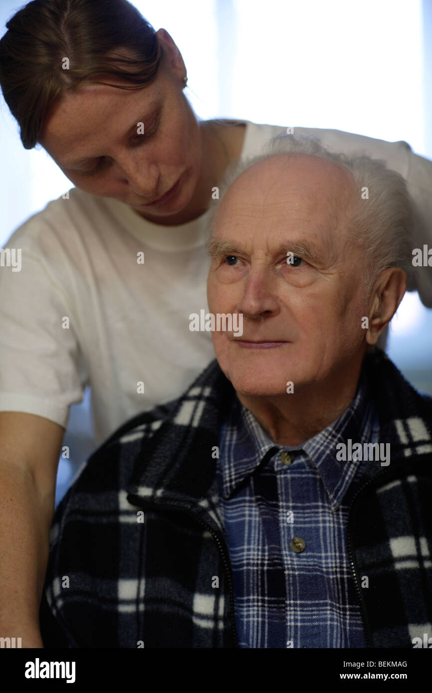 invalid man in wheelchair with female therapist Stock Photo - Alamy