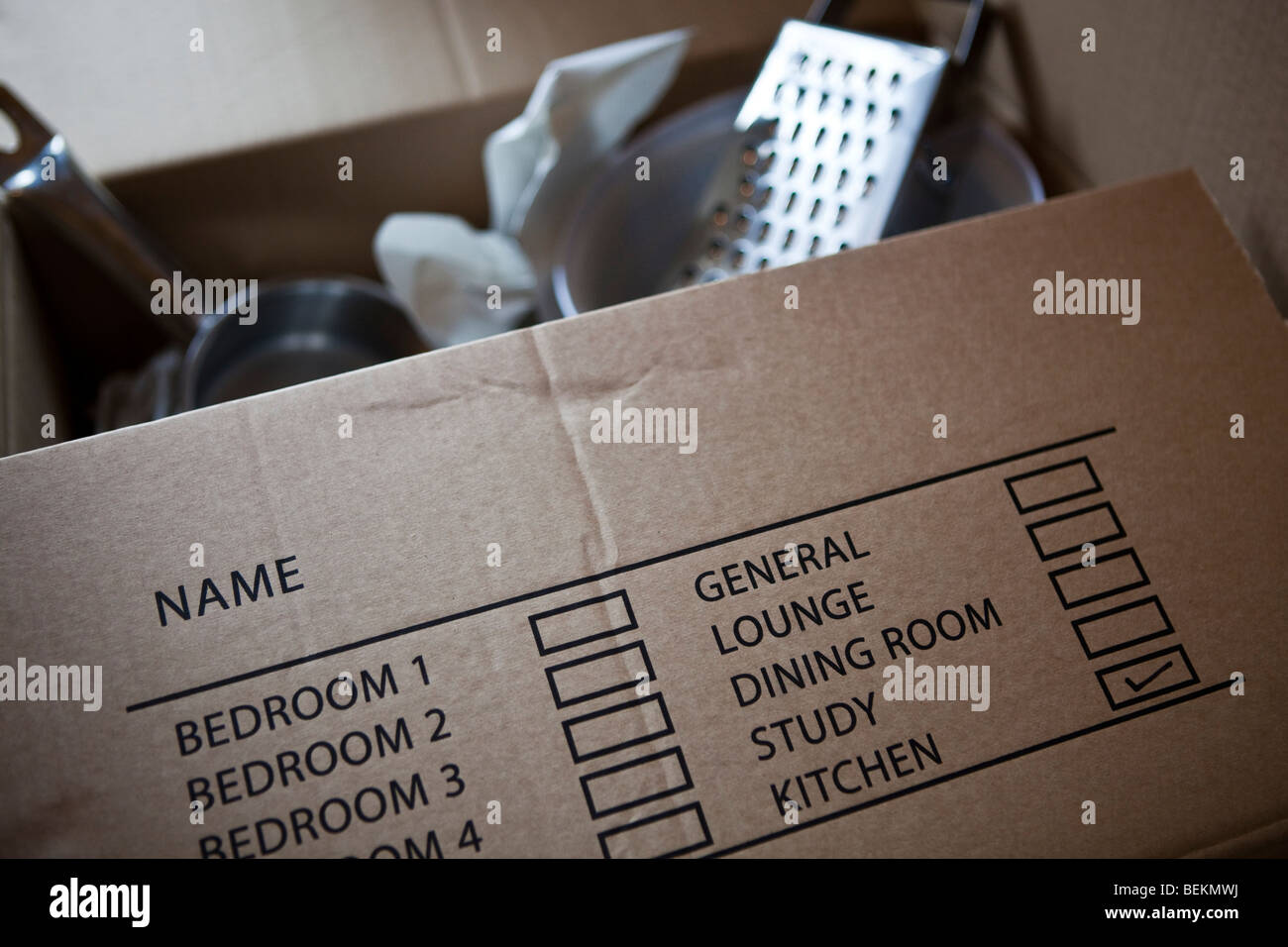 Kitchen items packed into a box / carton as part of a house move. The ...