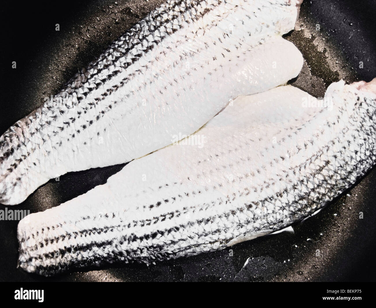 Fish Fillets In Frying Pan Stock Photo - Alamy