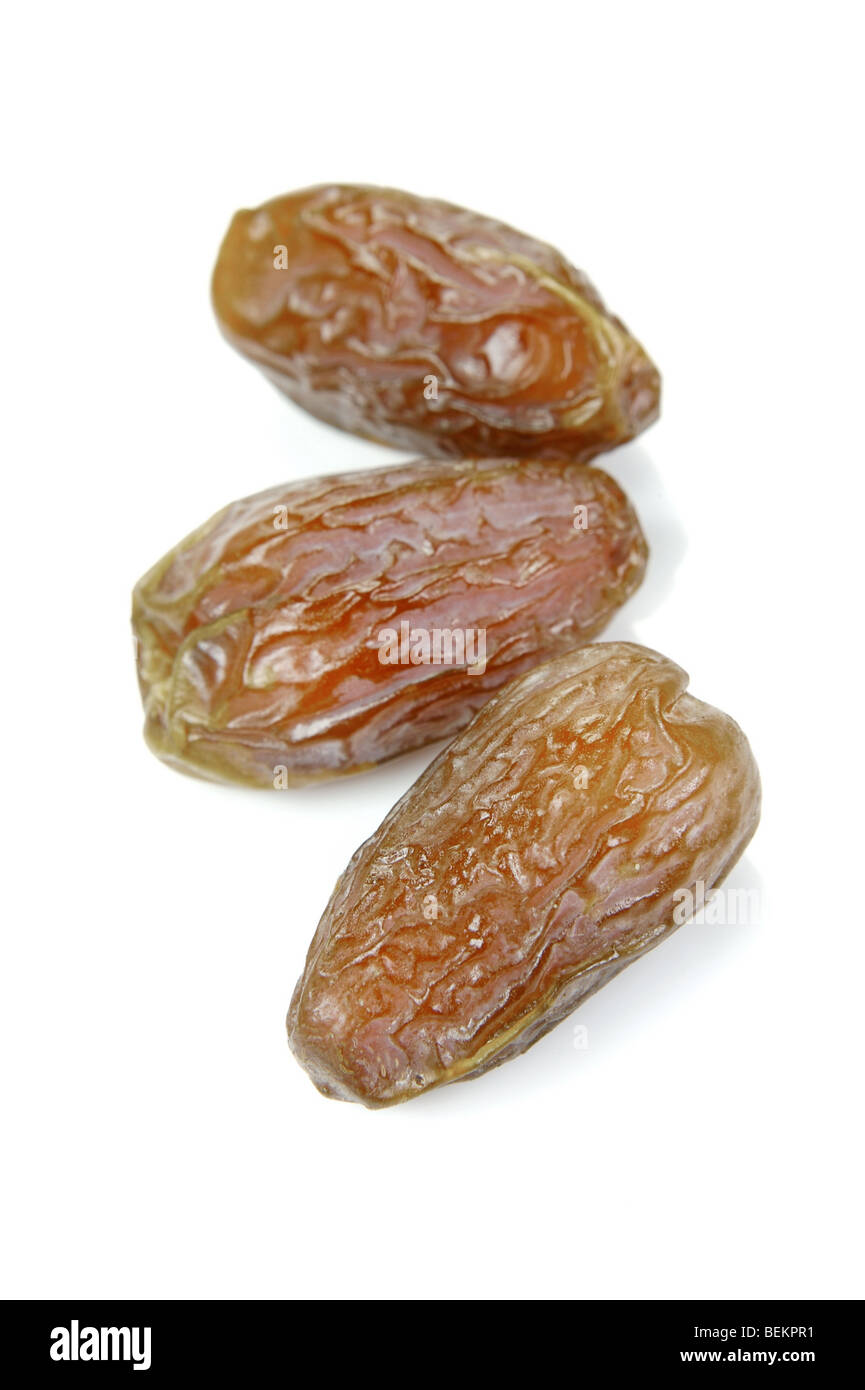 Dates isolated against a white background Stock Photo - Alamy