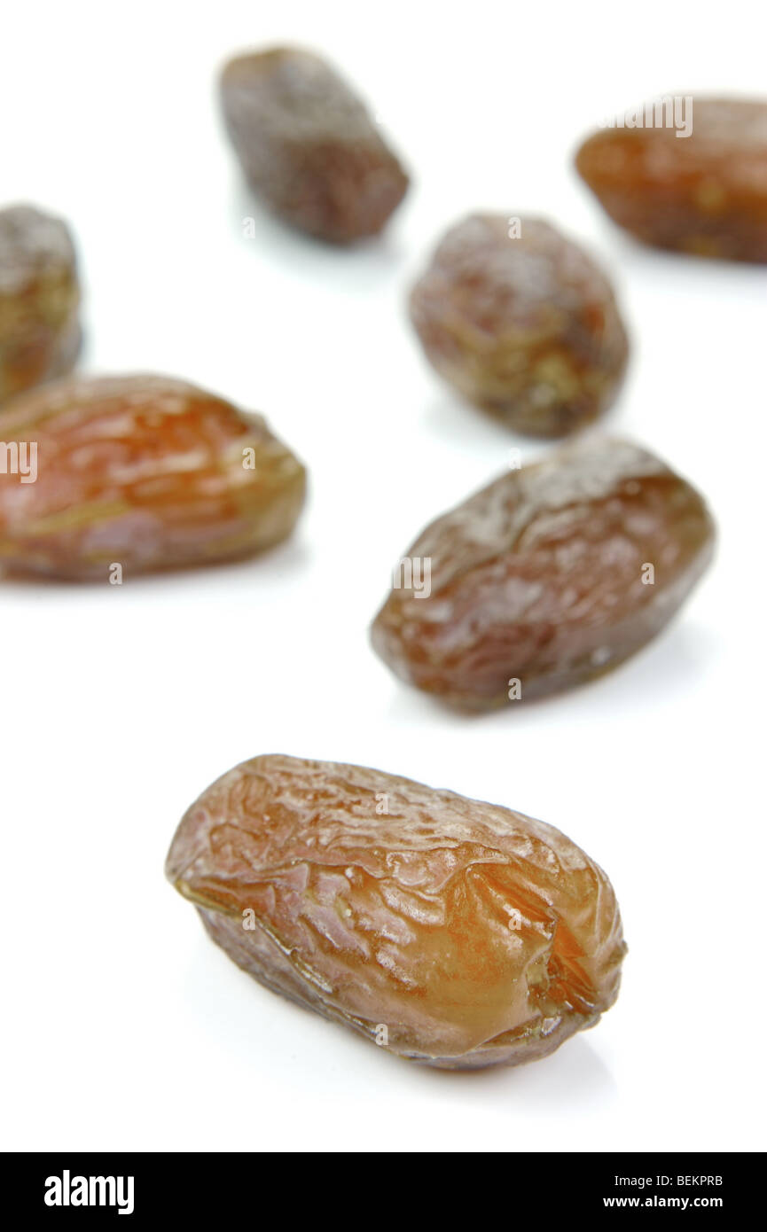Dates isolated against a white background Stock Photo - Alamy