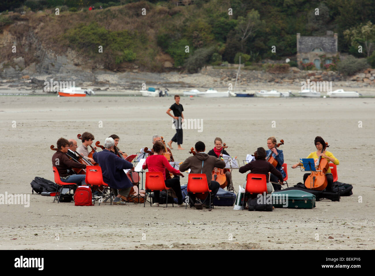 Cellists playing on a beach in Brittany, France Stock Photo - Alamy