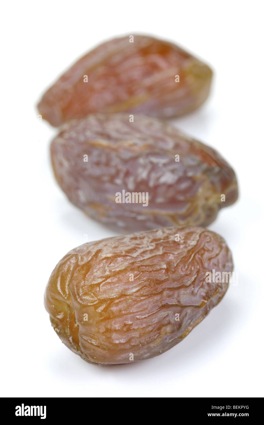 Dates isolated against a white background Stock Photo - Alamy
