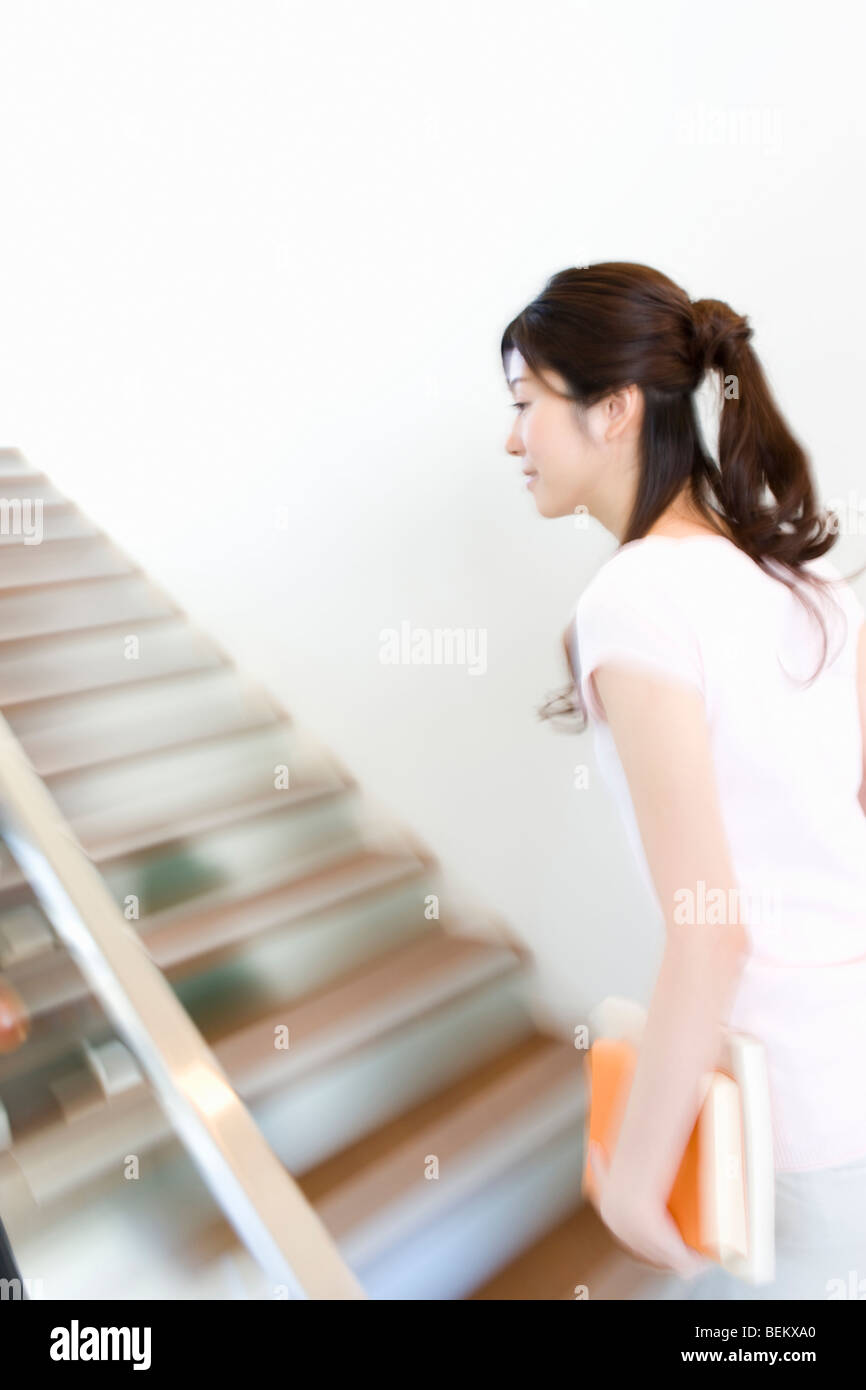 Climbing up the stairs Stock Photo - Alamy