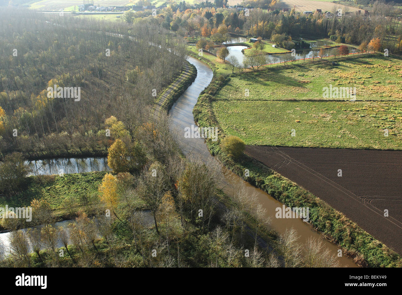 Fields, grasslands and forested area along river Demer from the air in ...