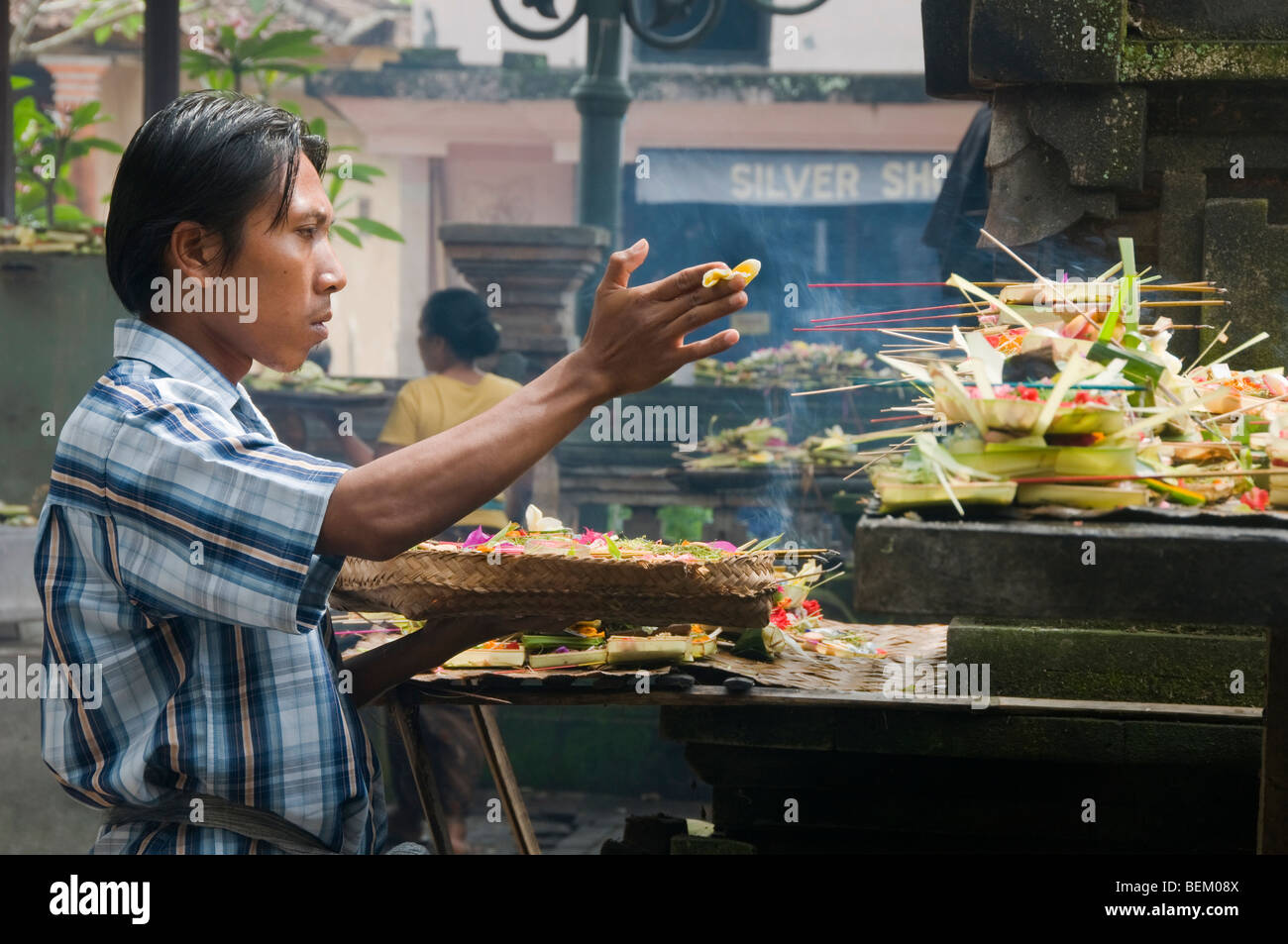 offering being made at a temple in Ubud in Bali Indonesia Stock Photo ...