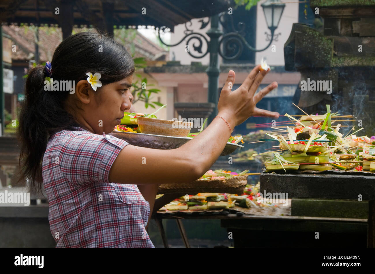 offering being made at a temple in Ubud in Bali Indonesia Stock Photo ...